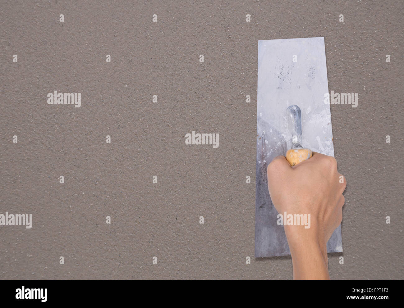 hand of builder worker use trowel plastering concrete at wall Stock ...