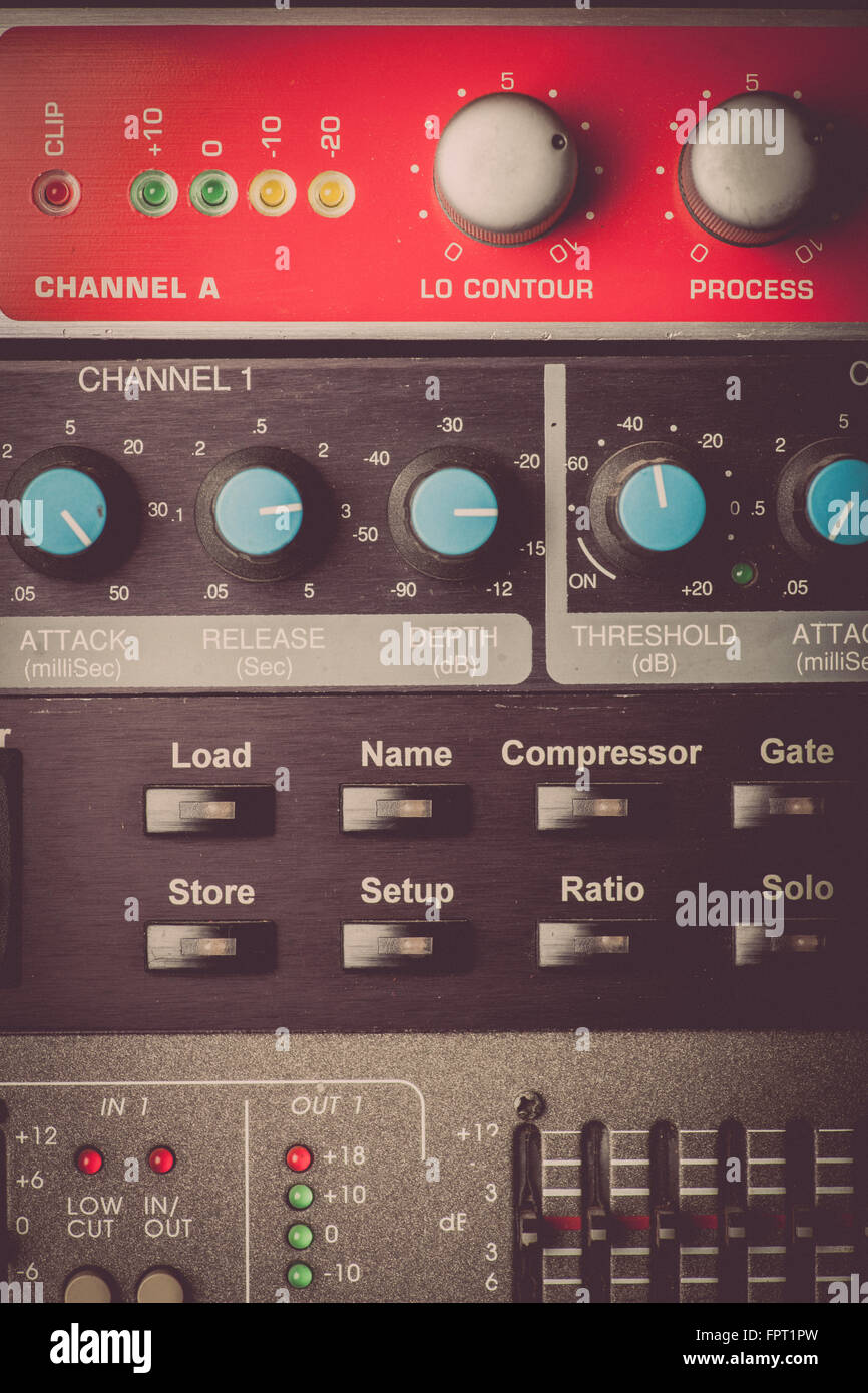 Color image of many buttons on a sound mixer in a recording studio ...