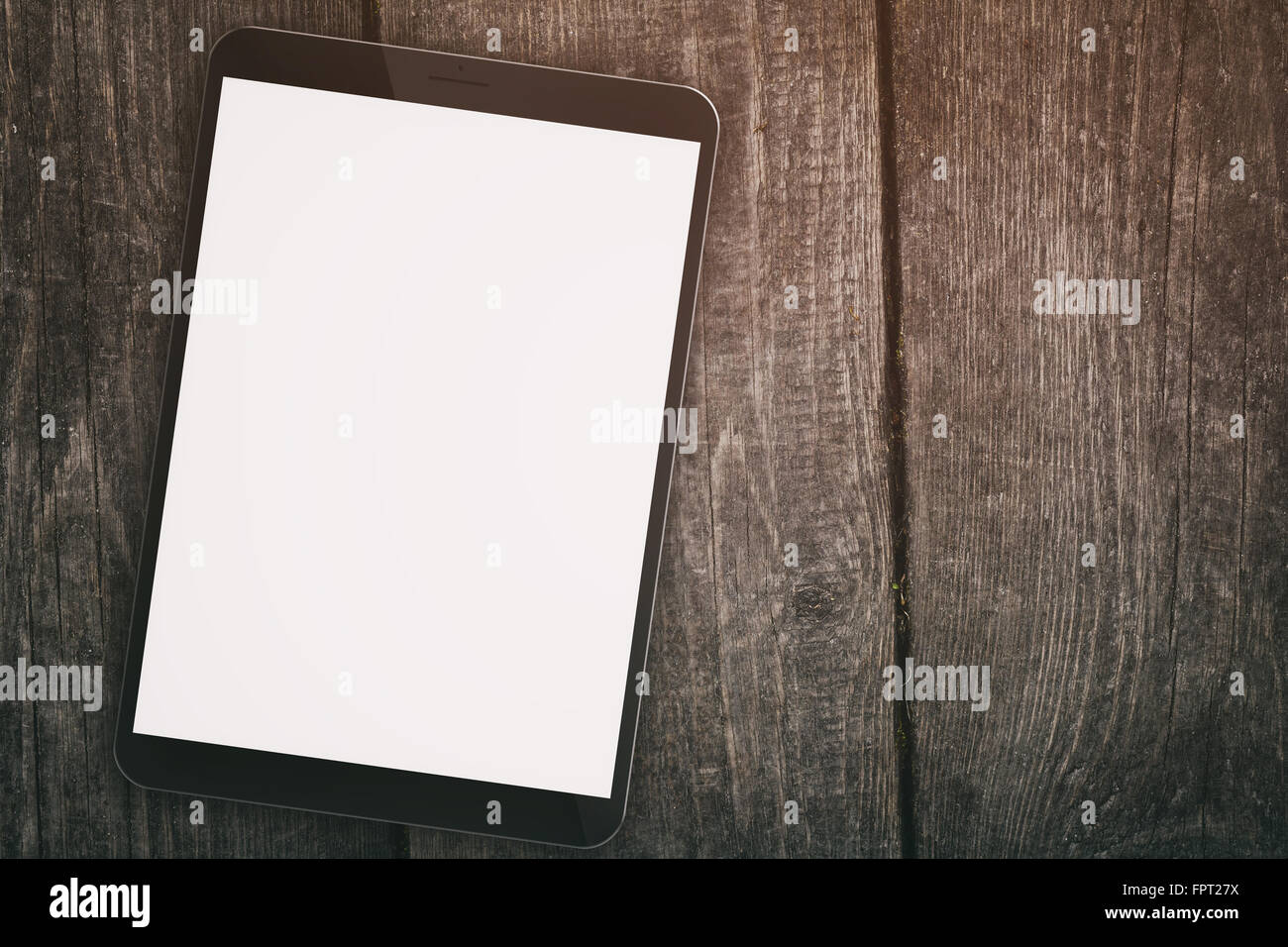generic tablet pc with blank screen on wood table Stock Photo - Alamy