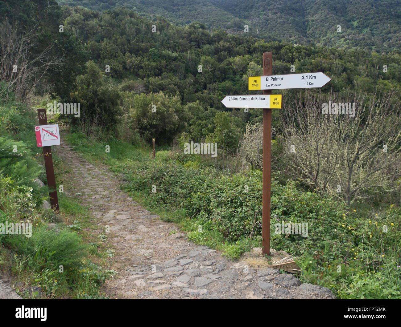 Hiking through Montes del Agua, footpath and signposts along the track ...