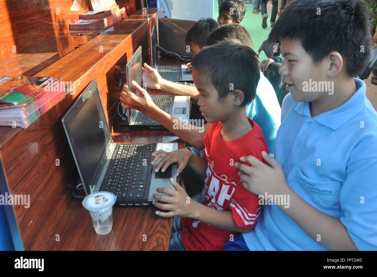 Makassar, Indonesia. Kids use computer Stock Photo - Alamy