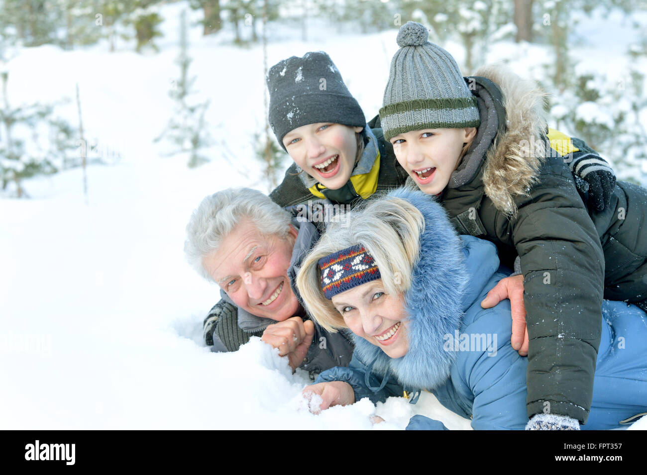 Happy family in warm Stock Photo - Alamy