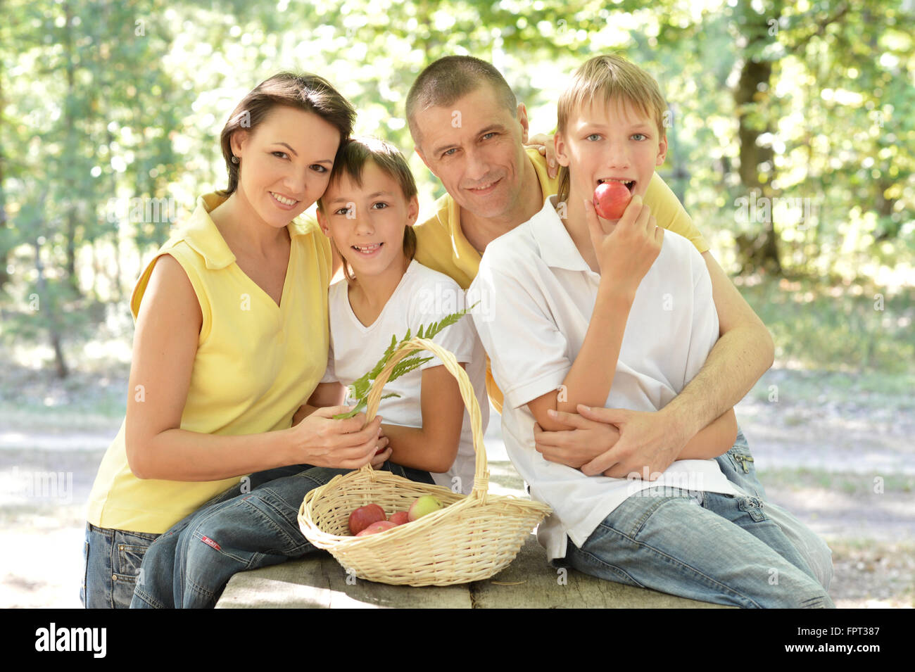 Happy family eating Stock Photo - Alamy