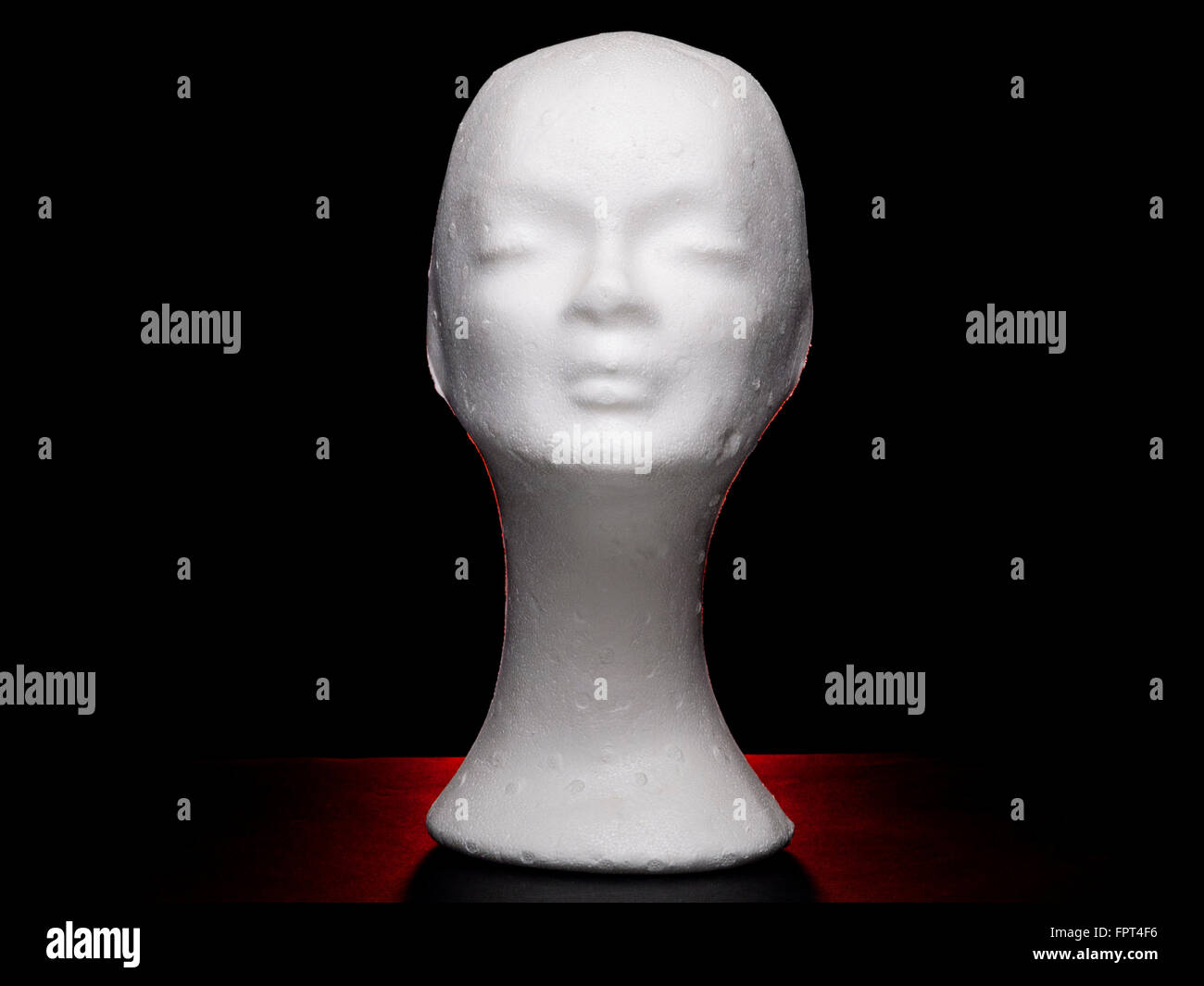 White dummy female head on black background Stock Photo - Alamy