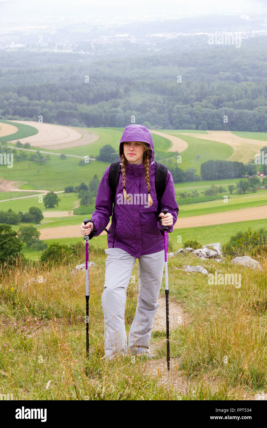 Young woman hiking in nature Stock Photo - Alamy