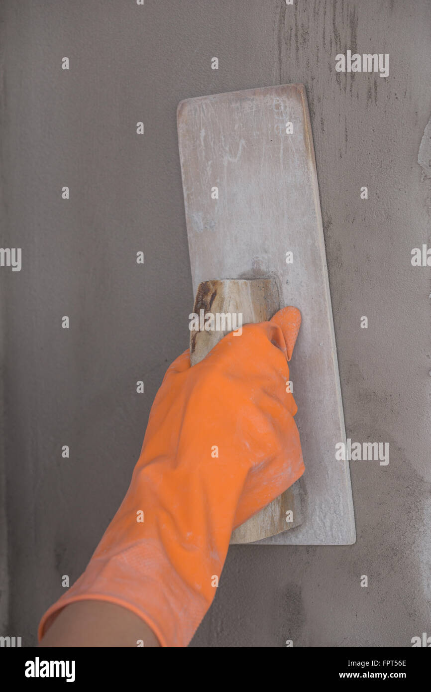 hand of builder worker use trowel plastering concrete at wall Stock ...