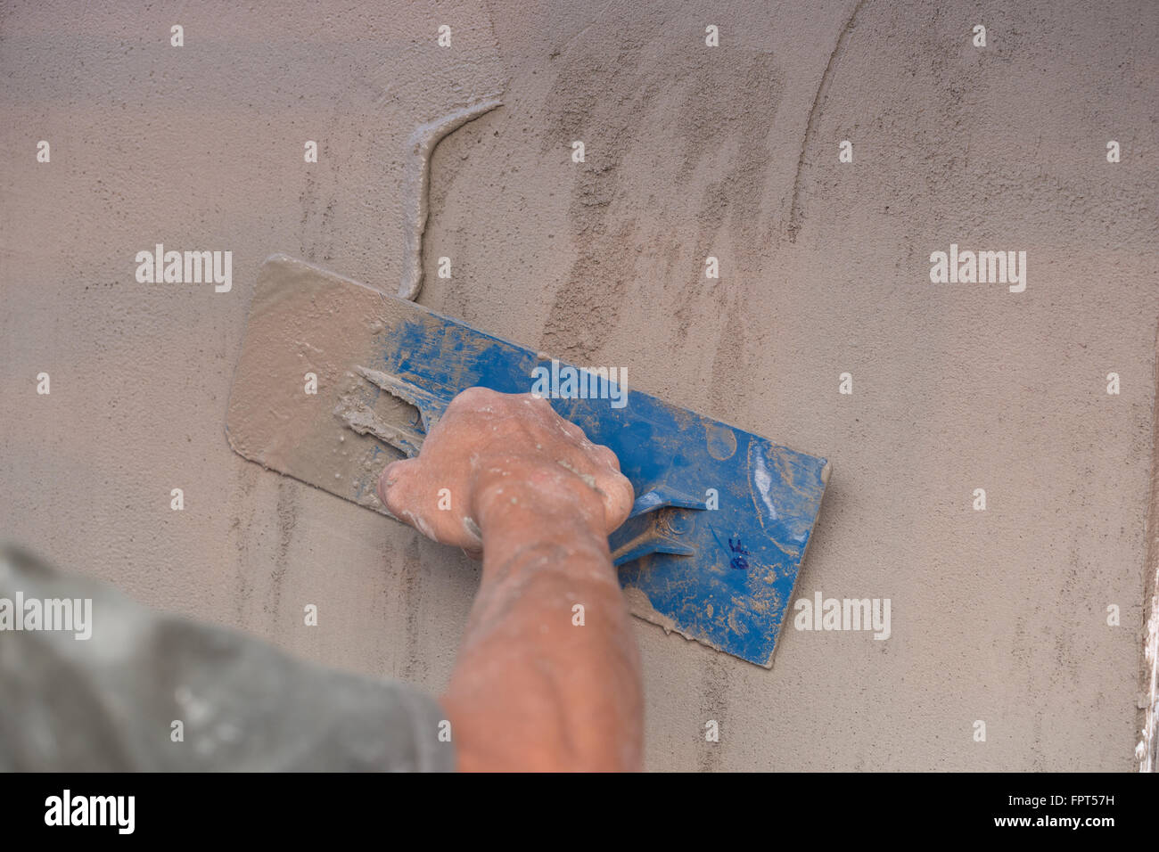 hand of builder worker use trowel plastering concrete at wall Stock ...