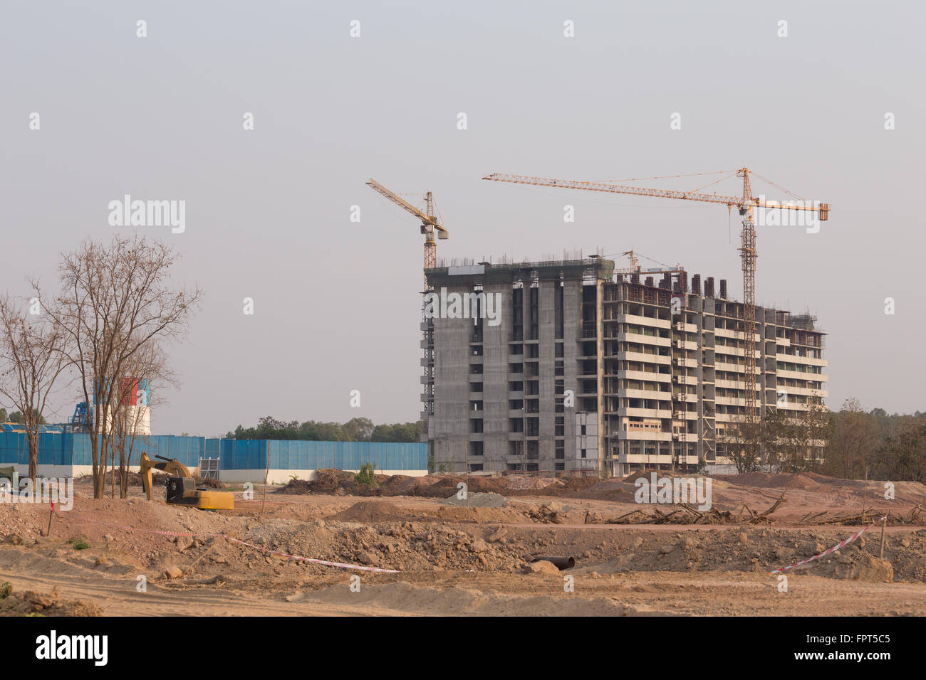 Building construction with Crane at construction site Stock Photo - Alamy