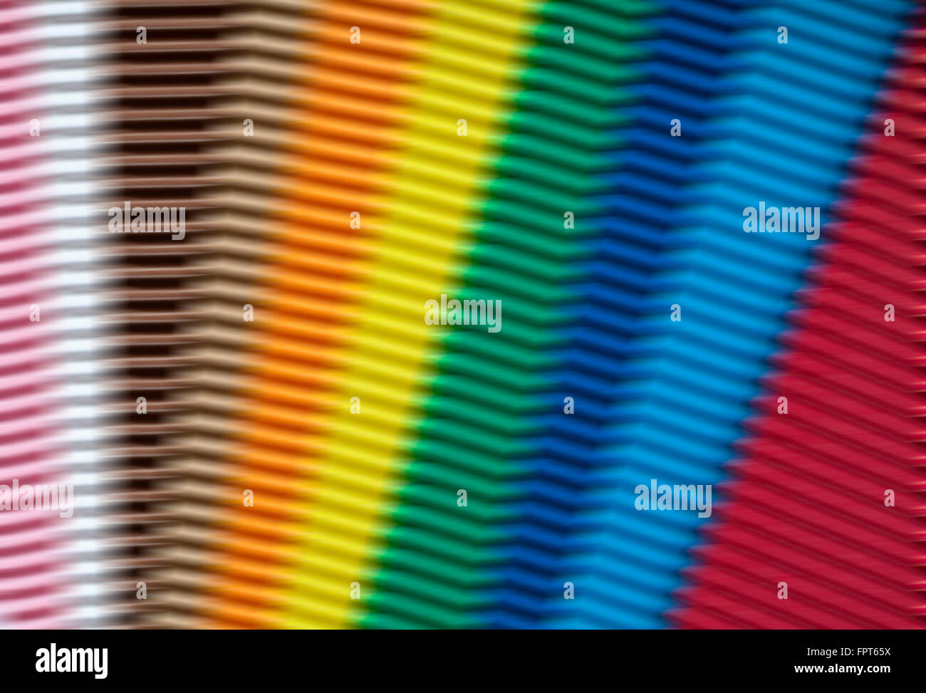 abstract blurs of diagonal lines of colourful corrugated cardboard ...