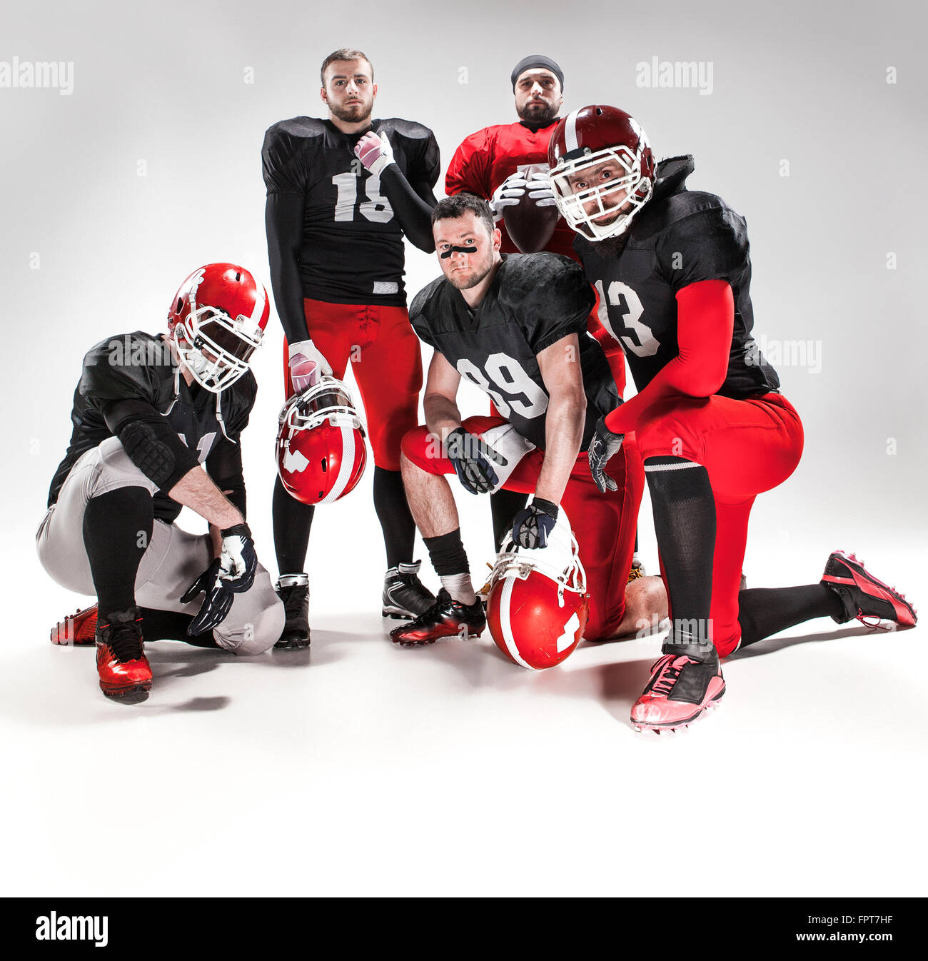 The five caucasian fitness men as american football players posing full ...