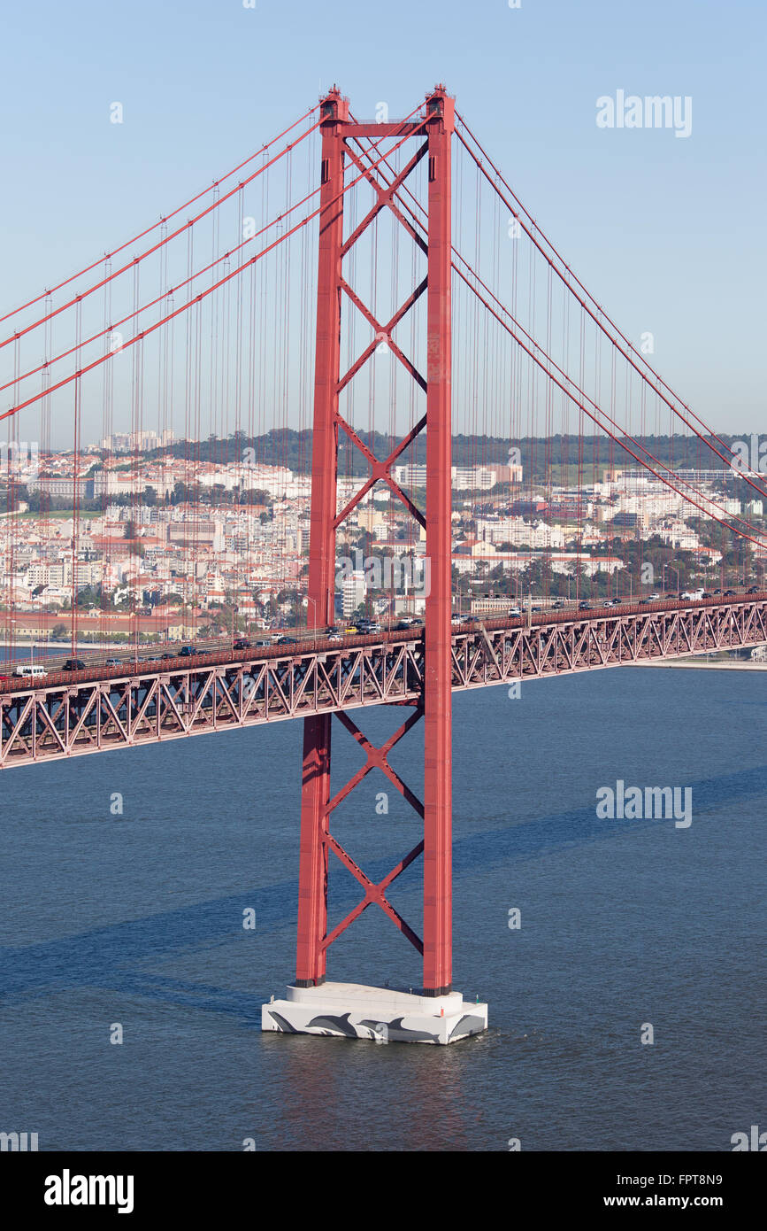 The 25 de Abril Bridge suspension bridge pylon, tower, over Tagus (Tejo ...