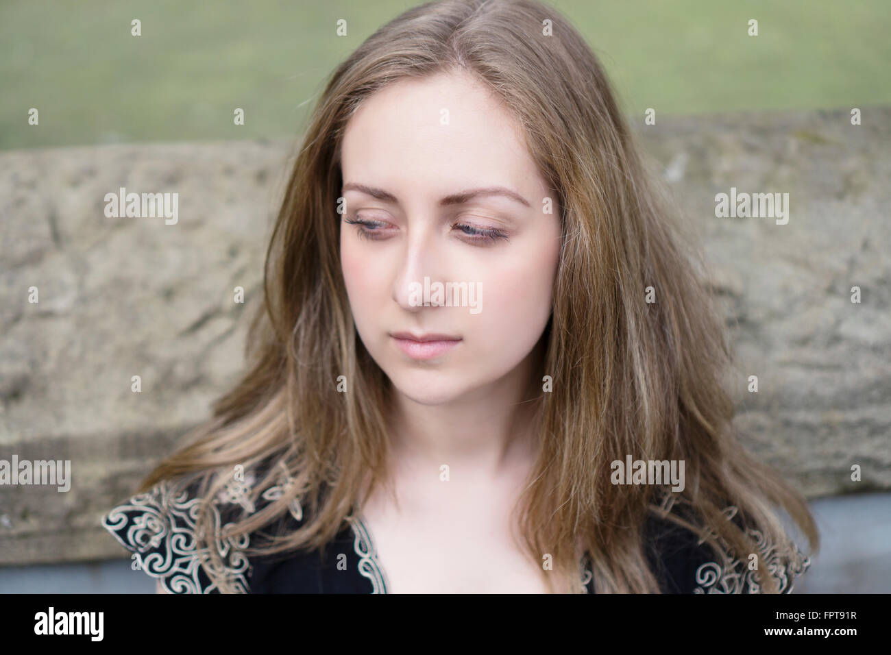 Woman looking away outdoors Stock Photo - Alamy