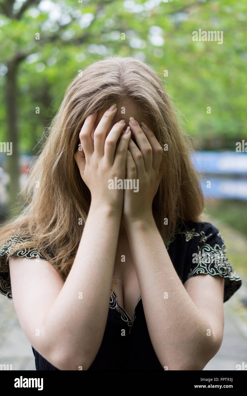 Woman embarrassed hands hi-res stock photography and images - Alamy