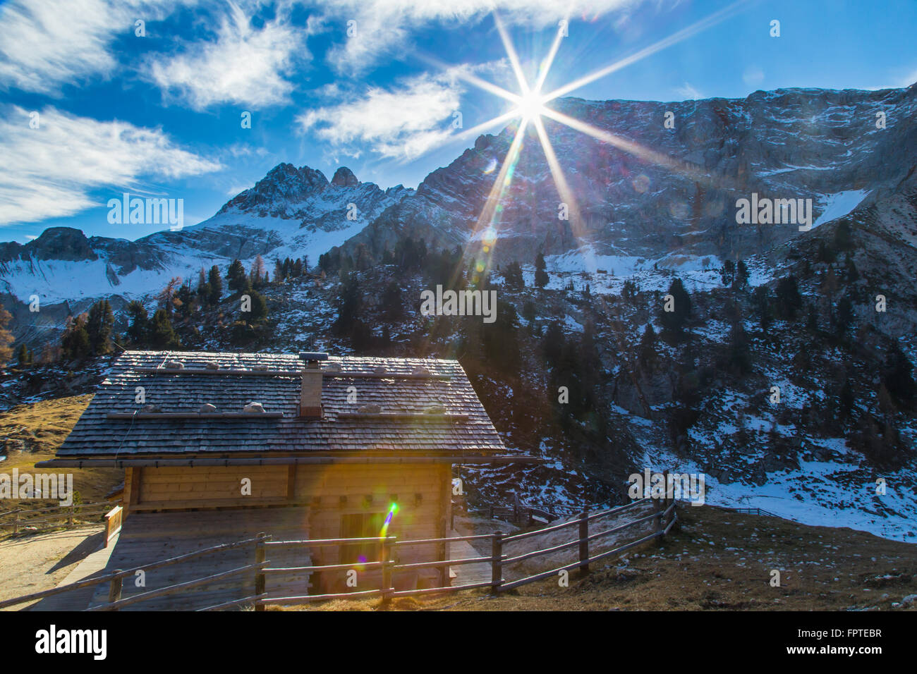 Alpine hut with a bench in the italian alps Stock Photo - Alamy