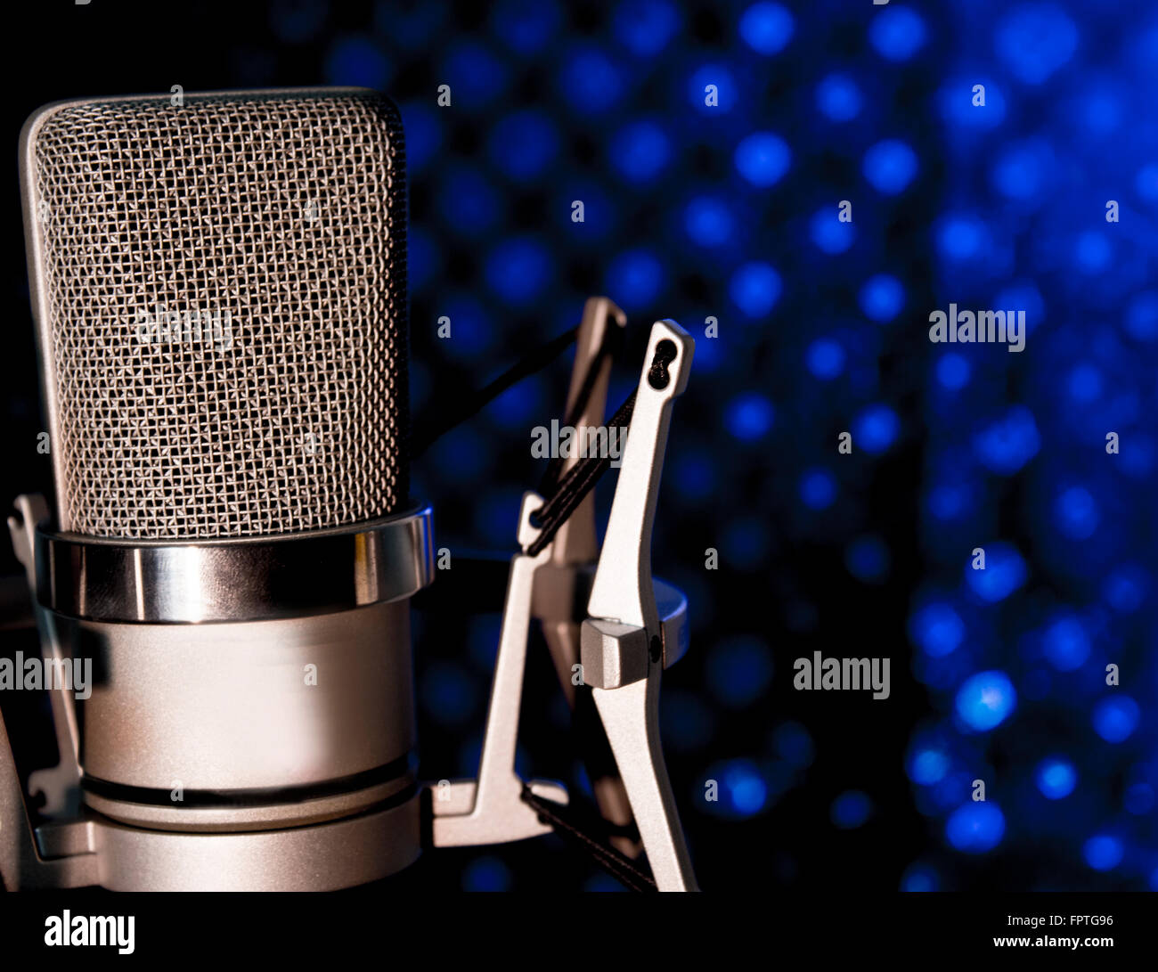Professional microphone silver on black and blue background Stock Photo ...