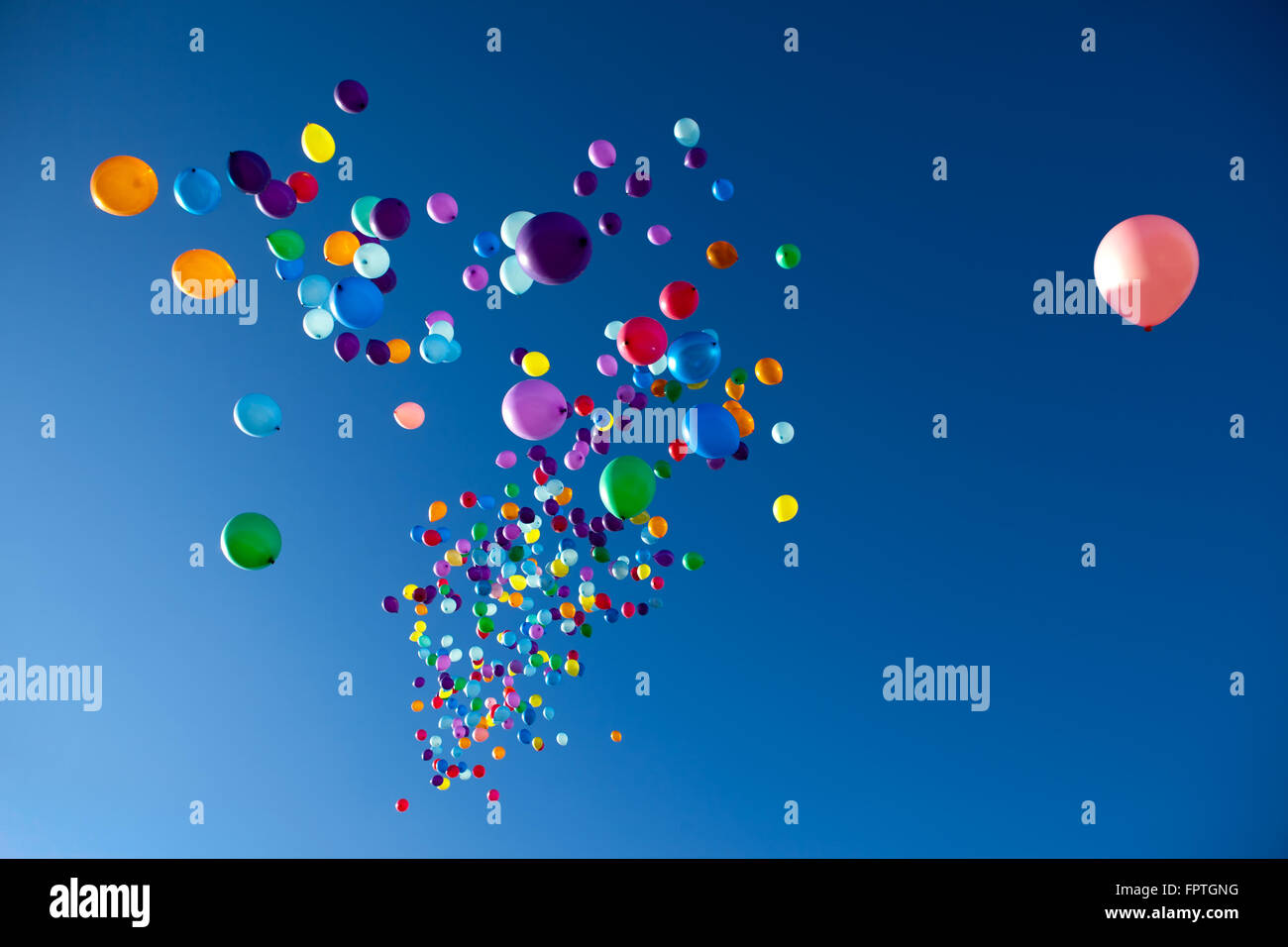 Colorful Balloons flying in the sky party Stock Photo - Alamy
