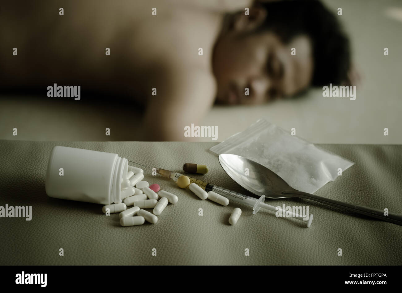 drugs and drug addict, laying in the background Stock Photo - Alamy
