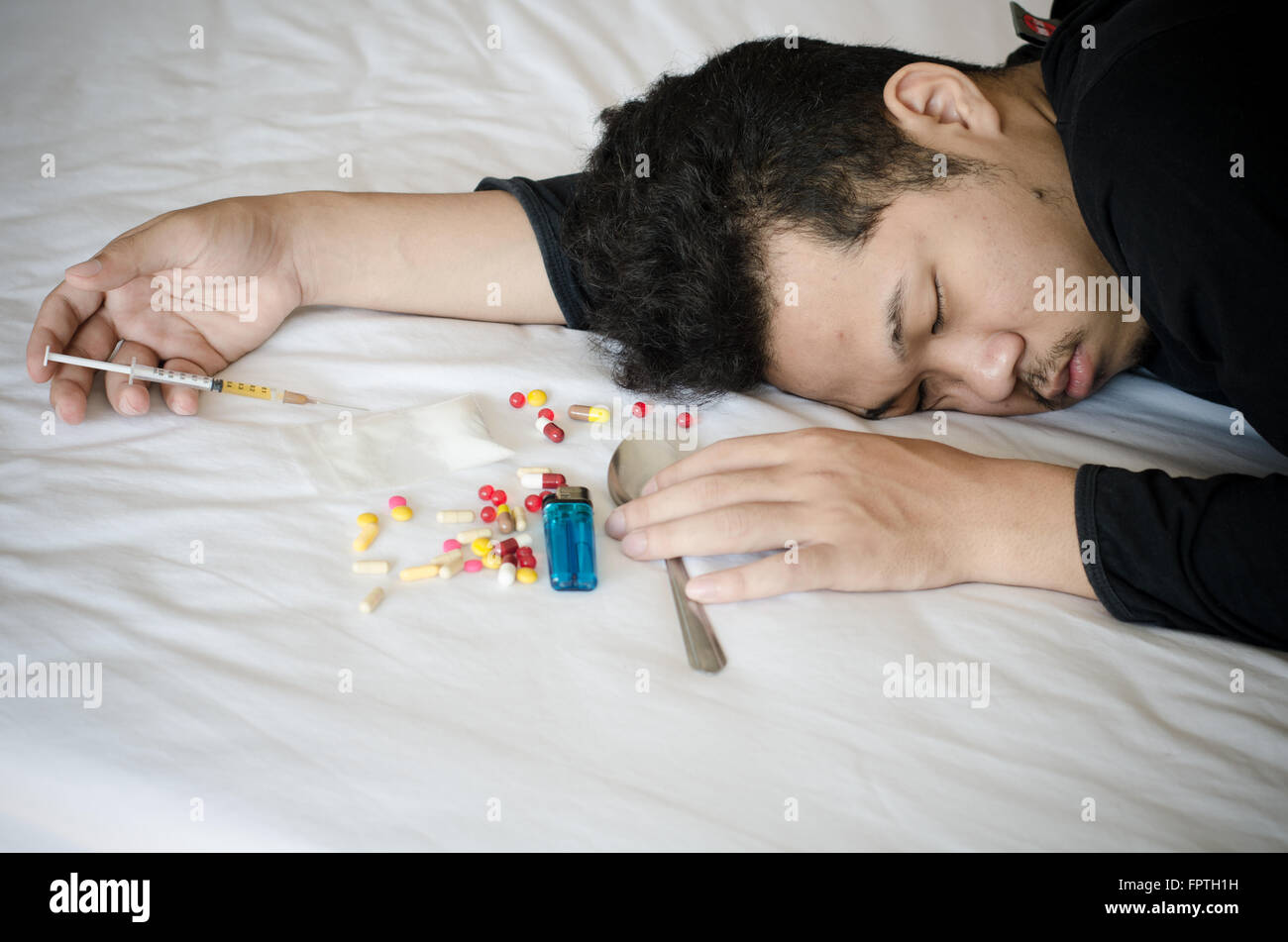 drug addict laying on the bed Stock Photo - Alamy