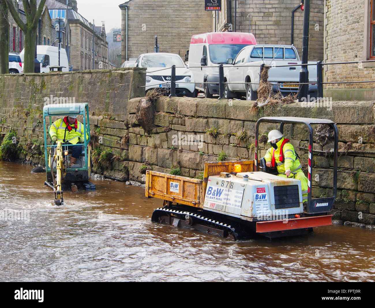 Clearing stones and debris from the floor of the River Calder in Hebden ...