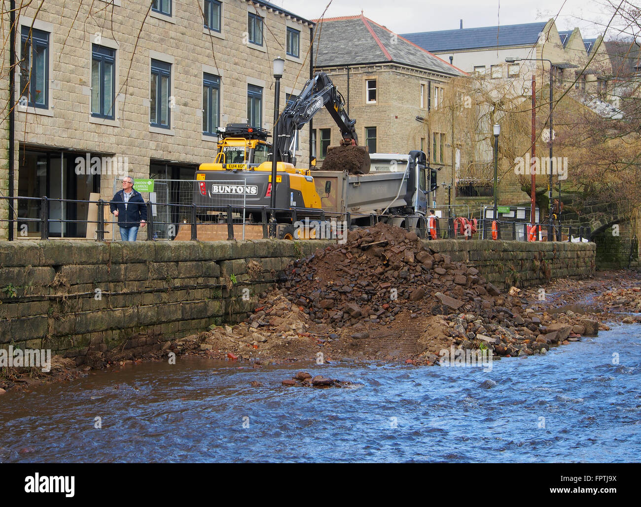 Clearing stones and debris from the floor of the River Calder in Hebden ...