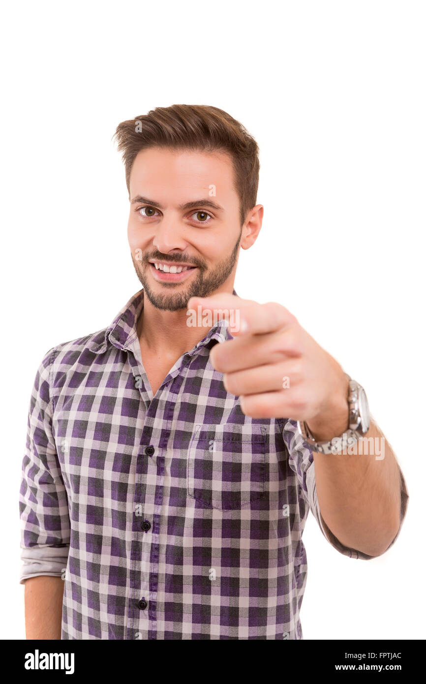 Handsome young man pointing at you, isolated over white background ...