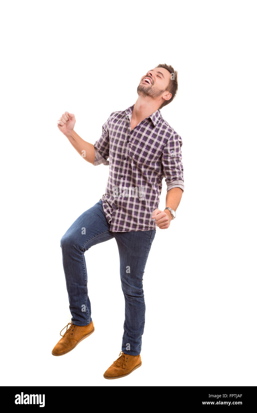 Young man celebrating - isolated over white background Stock Photo - Alamy