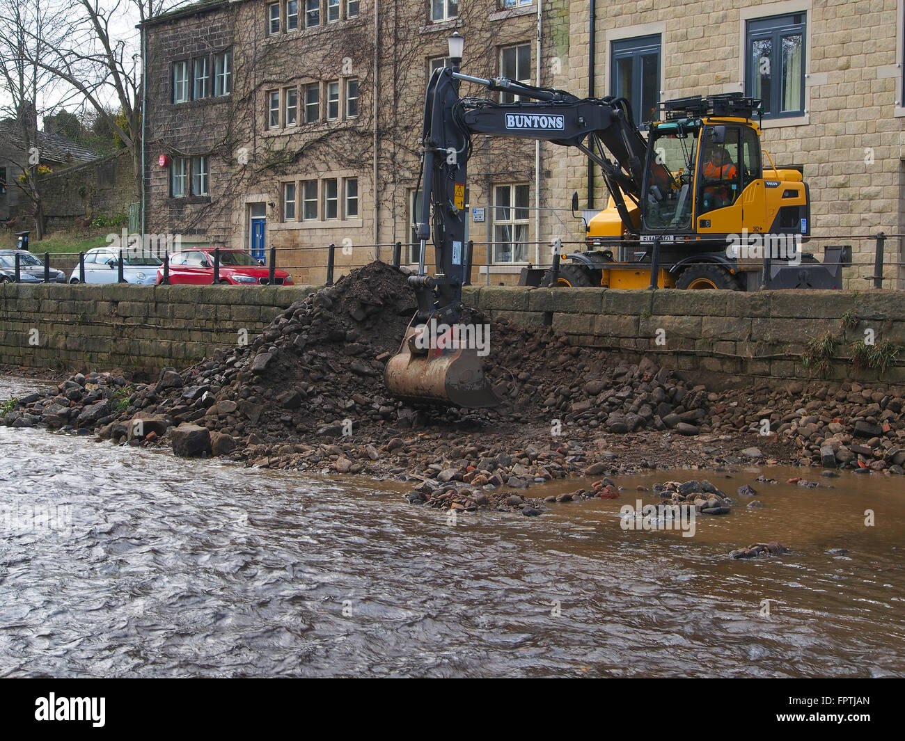 Clearing stones and debris from the floor of the River Calder in Hebden ...