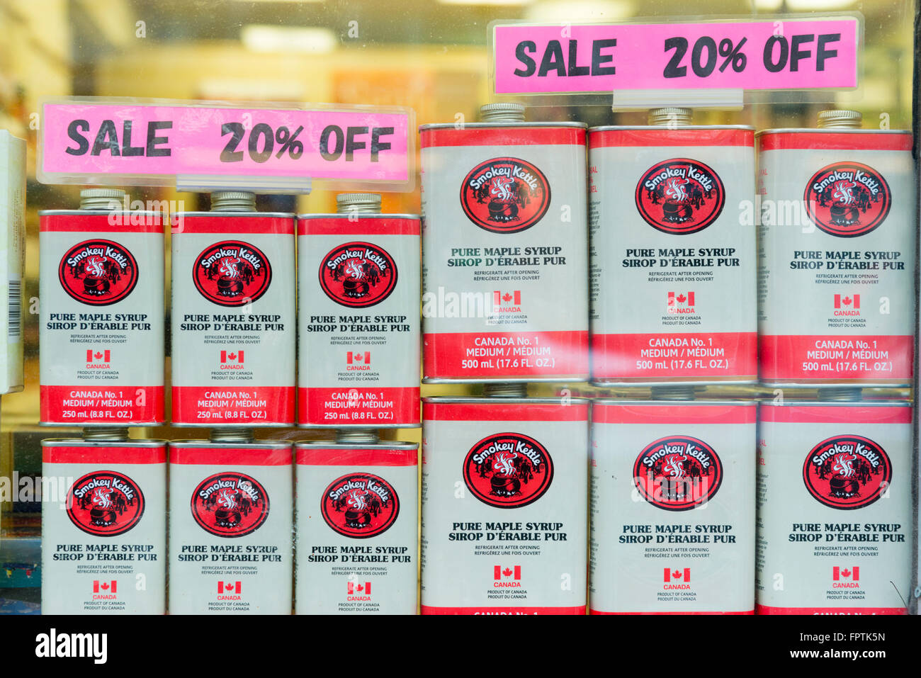 Tins of Maple syrup for sale in a shop window in Banff Canada Stock ...