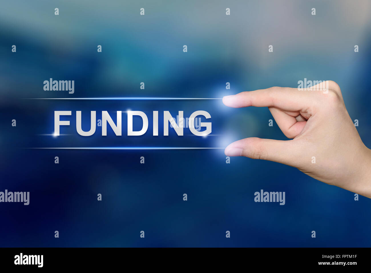 hand pushing funding button on blurred blue background Stock Photo - Alamy