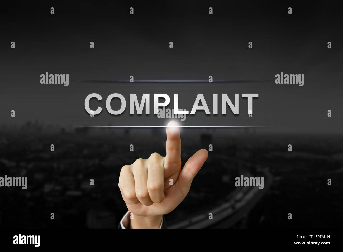 business hand clicking complaint button on black blurred background ...