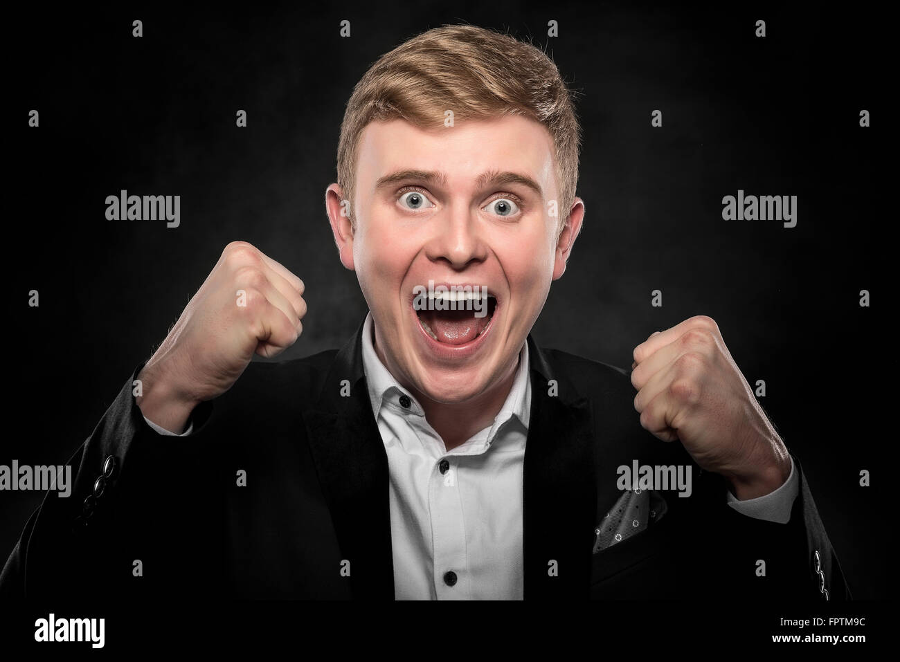 Young man rejoicing Stock Photo - Alamy