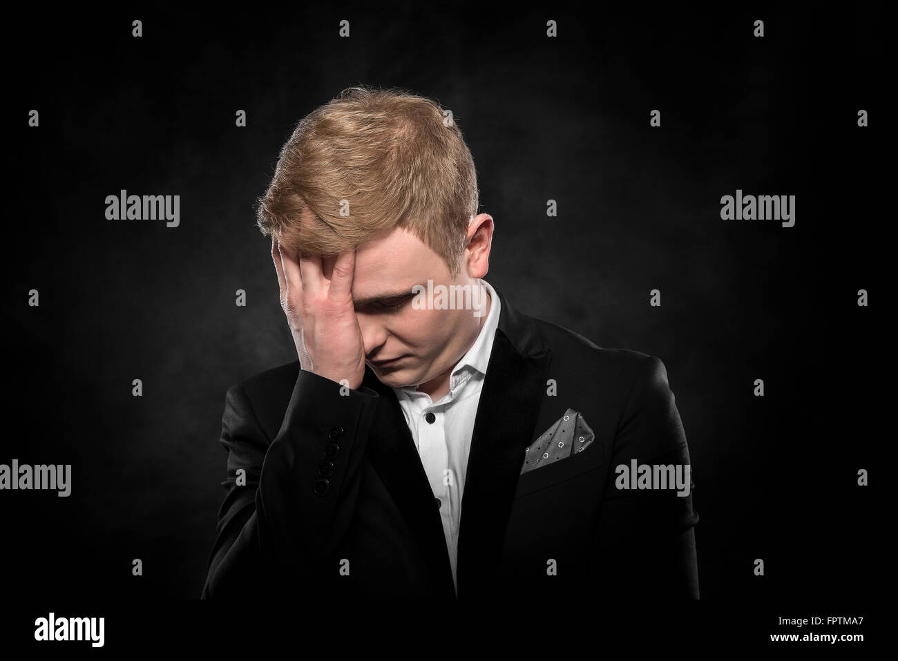 Man feeling a headache or intensely thinking Stock Photo - Alamy