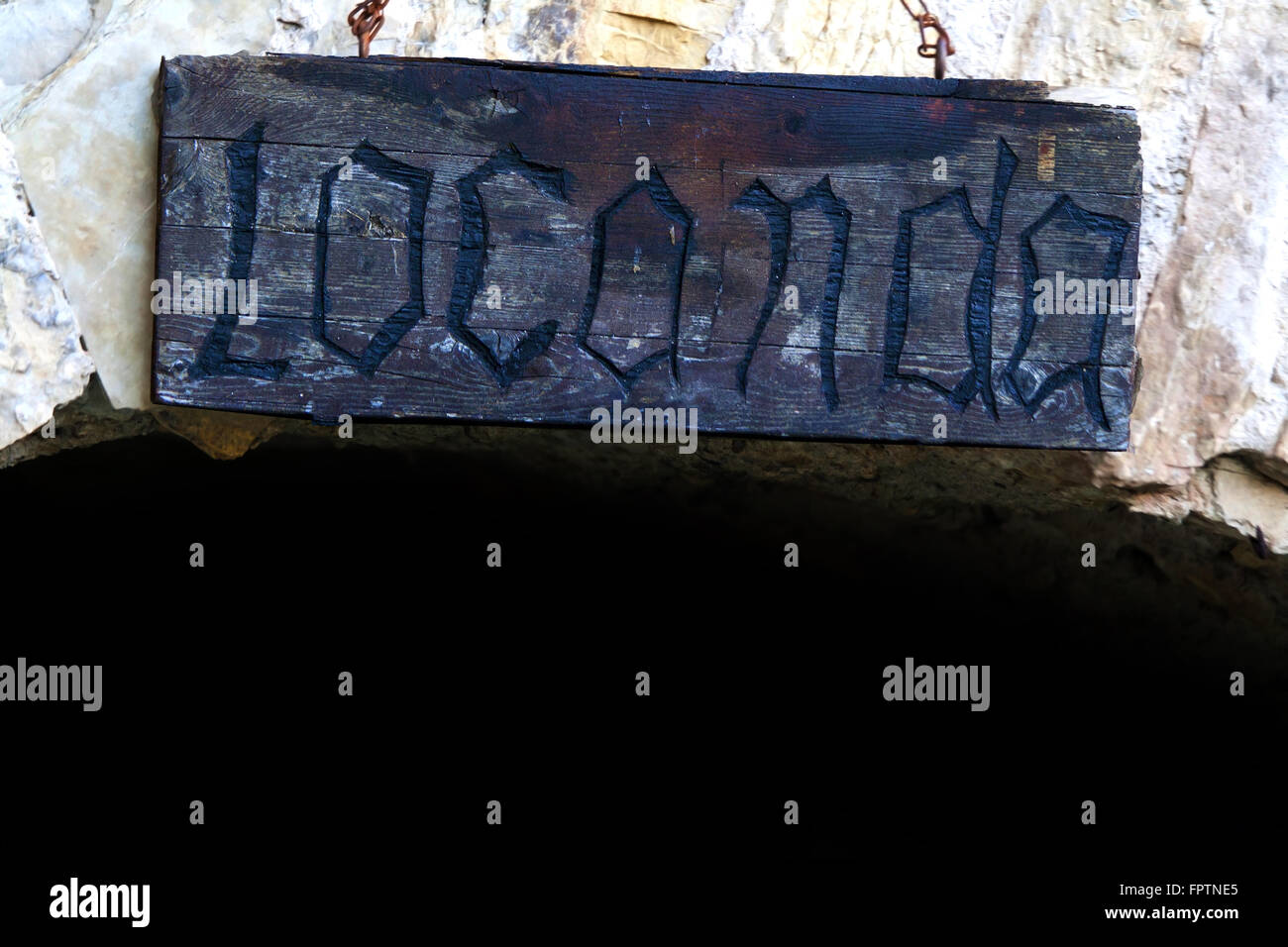 Signboard of a medieval guest house inside a castle Stock Photo - Alamy