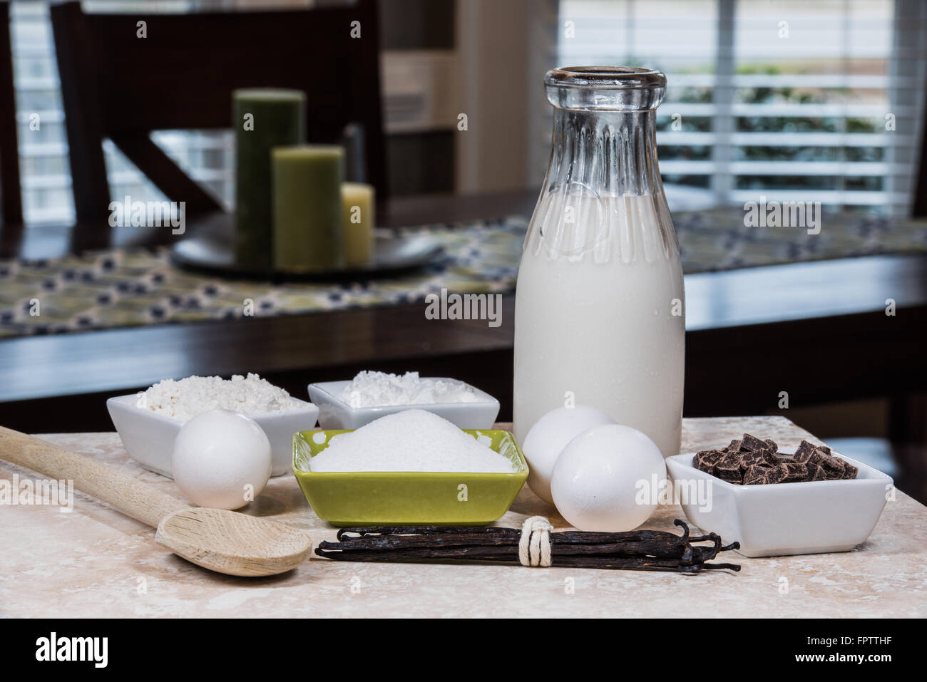 Baking ingredients in focus in front of a blurry dining room Stock ...