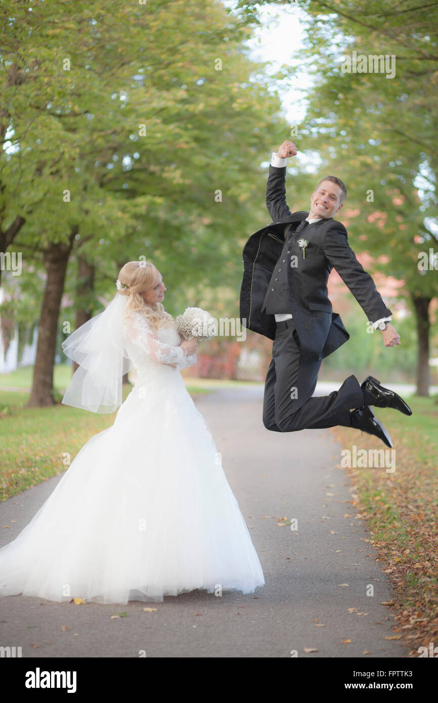 Happy wedding jumping groom hi-res stock photography and images - Alamy