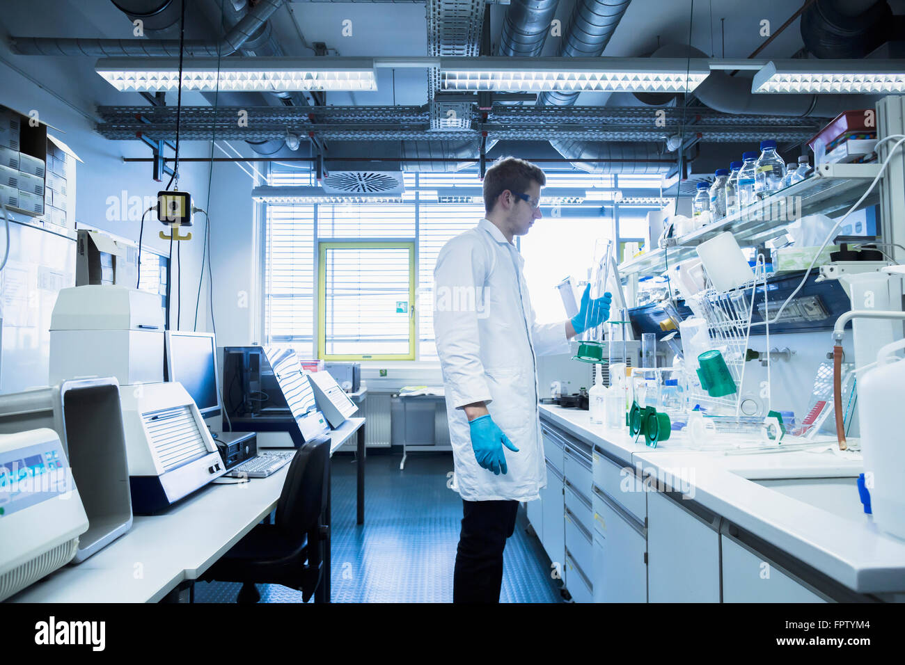 Scientist standing lab medical practice computer equipment hi-res stock ...
