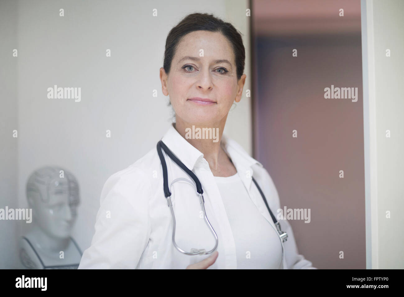 Portrait of a confident female doctor with stethoscope, Freiburg Im ...