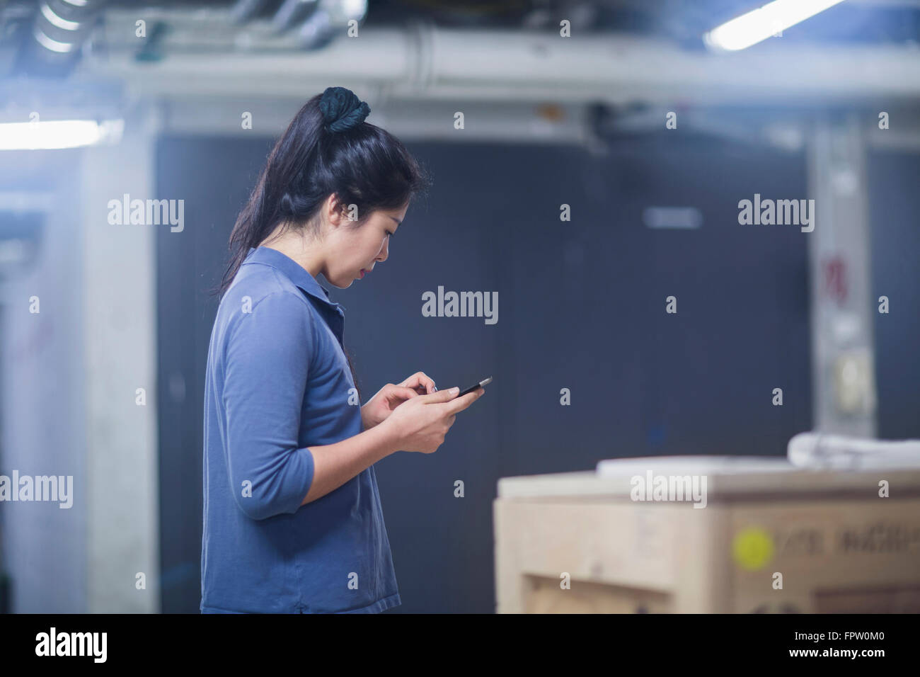 Young female engineer using a digital tablet in an industrial plant ...