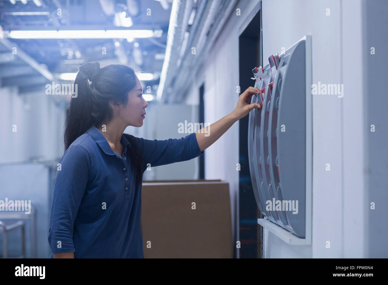 Young female engineer working in an industrial plant, Freiburg Im ...