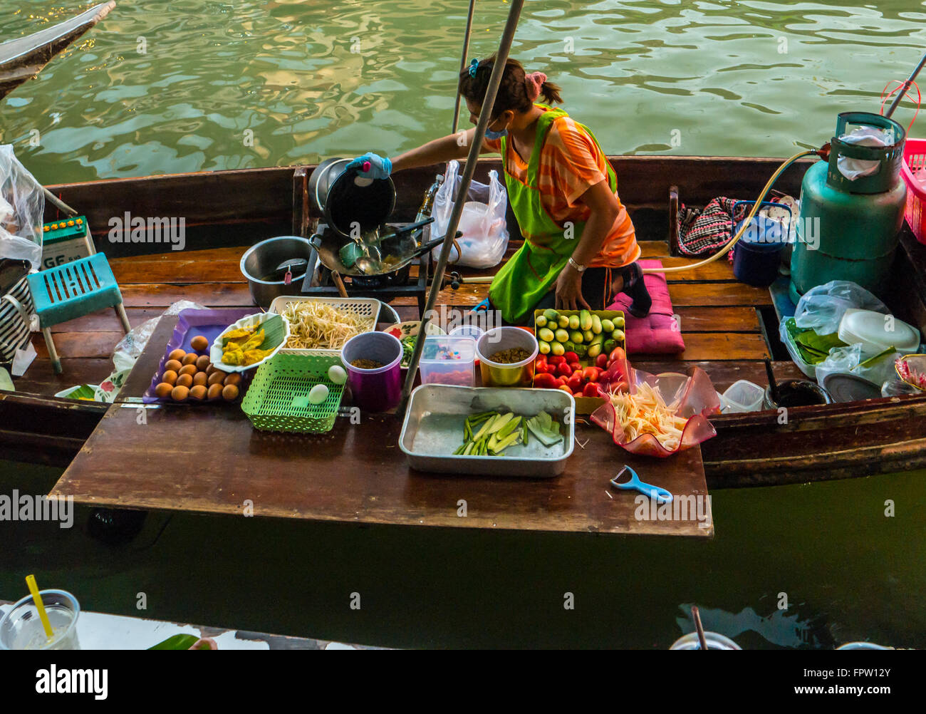Trader's boats in a floating market in Thailand Stock Photo - Alamy