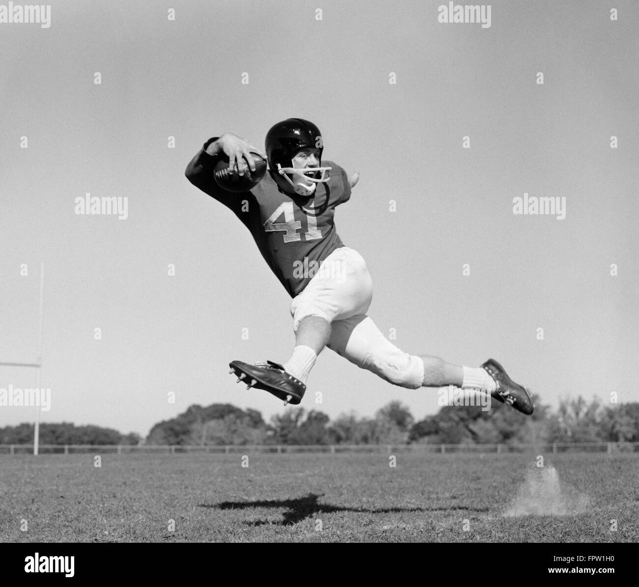 Running with the ball Black and White Stock Photos & Images - Alamy