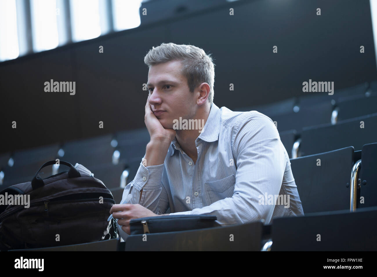 Grown man in classroom chair hi-res stock photography and images - Alamy