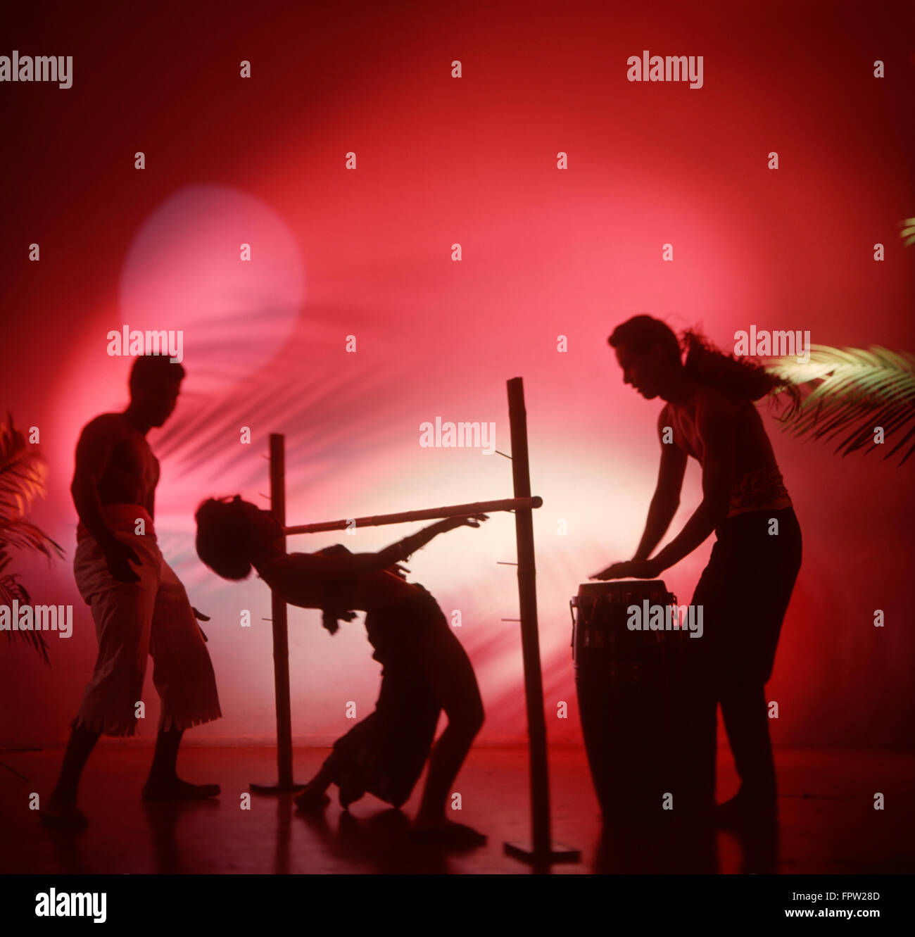 1950s SILHOUETTED LIMBO DANCERS WOMAN GOING UNDER BAR MAN PLAYING CONGA ...