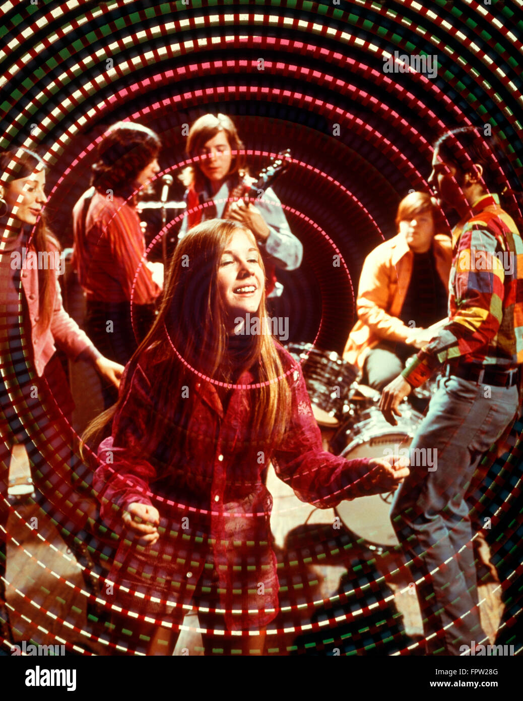 1970s TEENAGE ROCK BAND GROUP AND BOYS AND GIRLS DISCO DANCING AMID ...