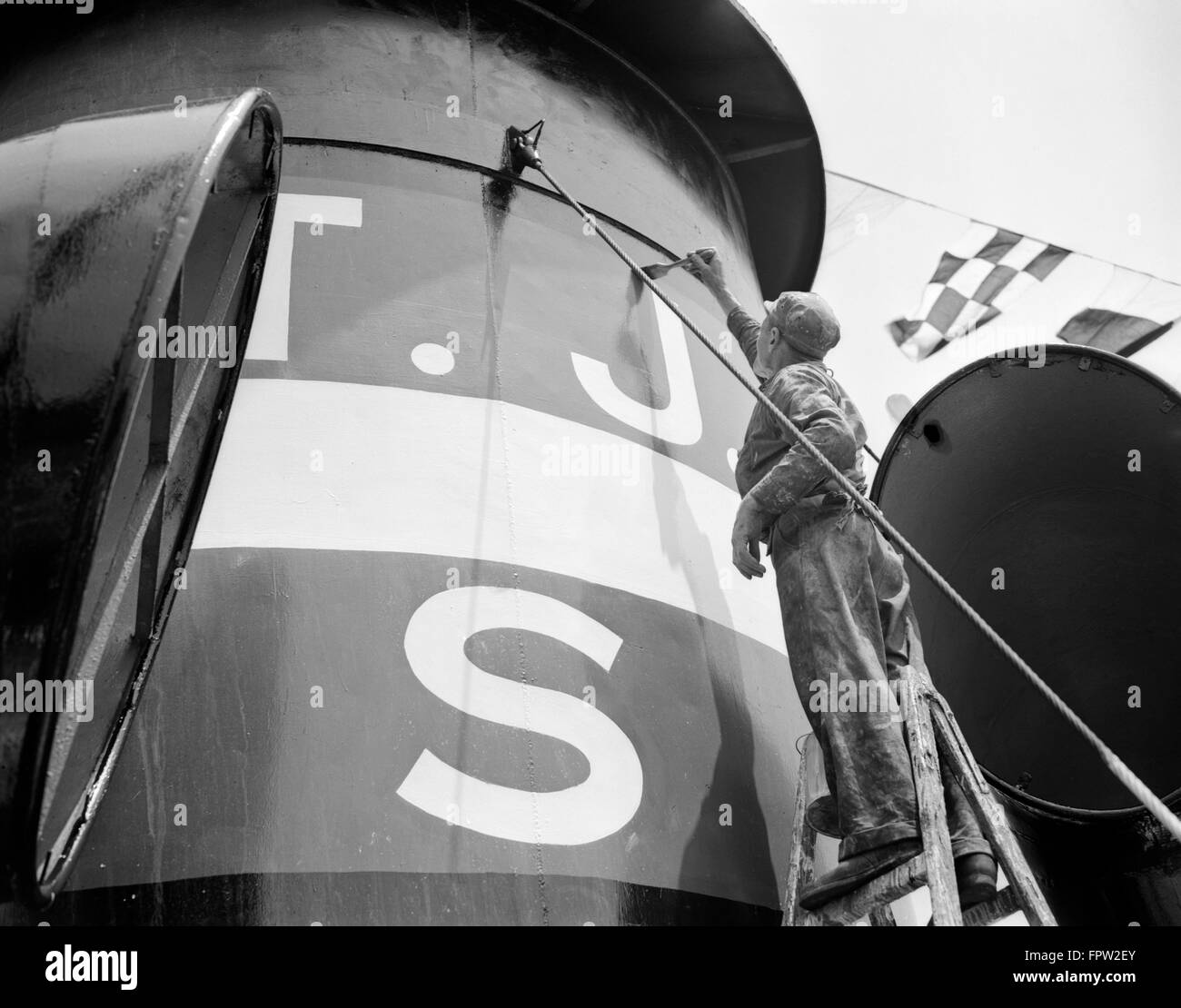 Man painting brush on Black and White Stock Photos & Images - Alamy