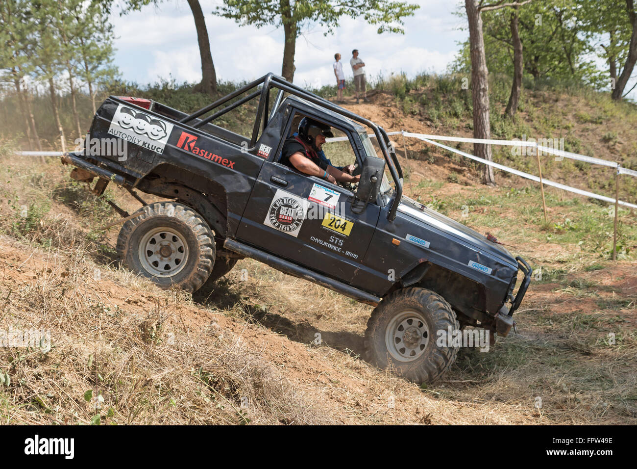 Black off road car successfully rolled off by a defined path in ...