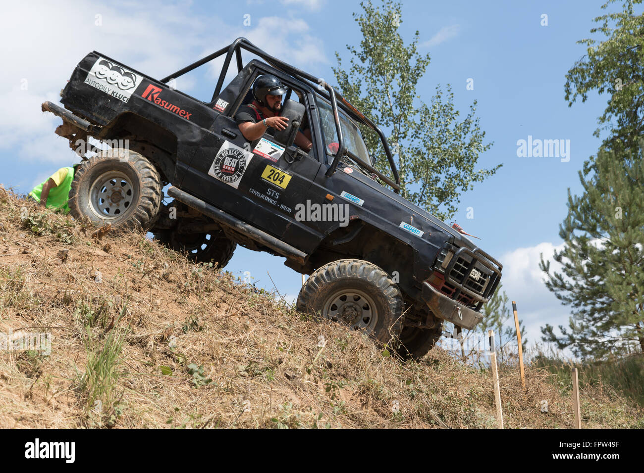 Black off road car is sliding down a steep slope in defined route Stock ...
