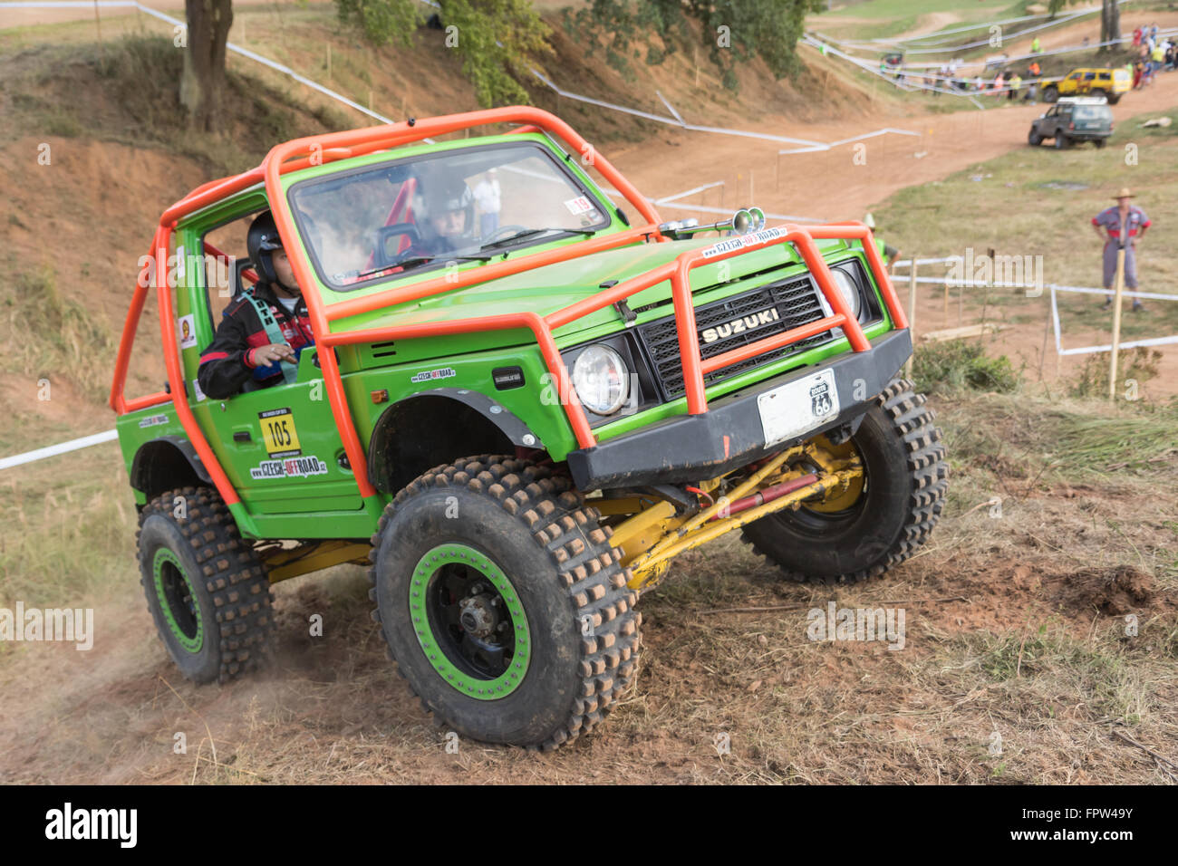 Small green off road car went up a steep slope Stock Photo - Alamy