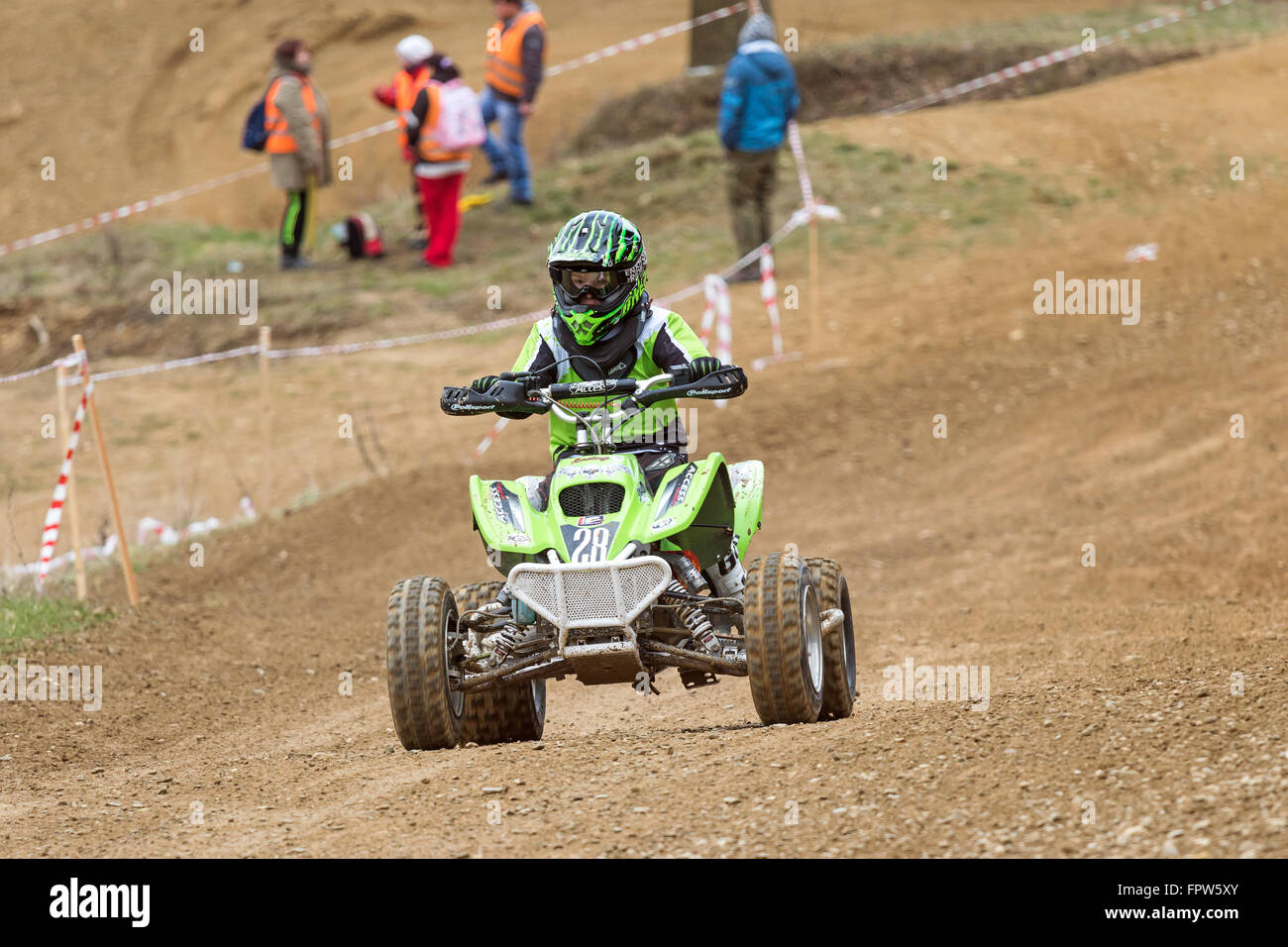 Front view of the child driving a quad in the race Stock Photo - Alamy