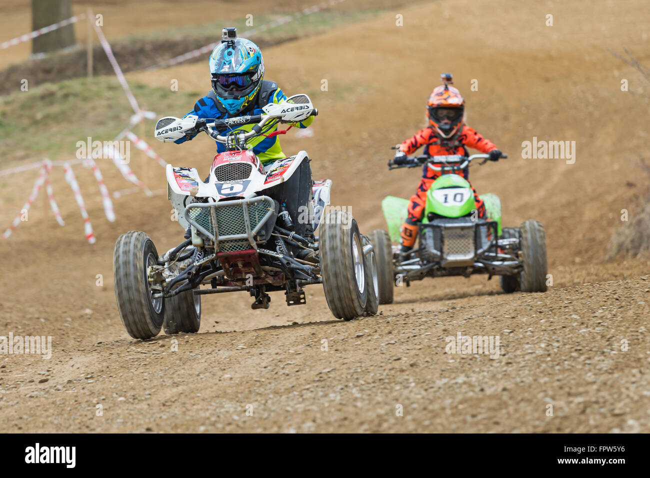 Young girl racer in the front during the children`s quad race Stock ...